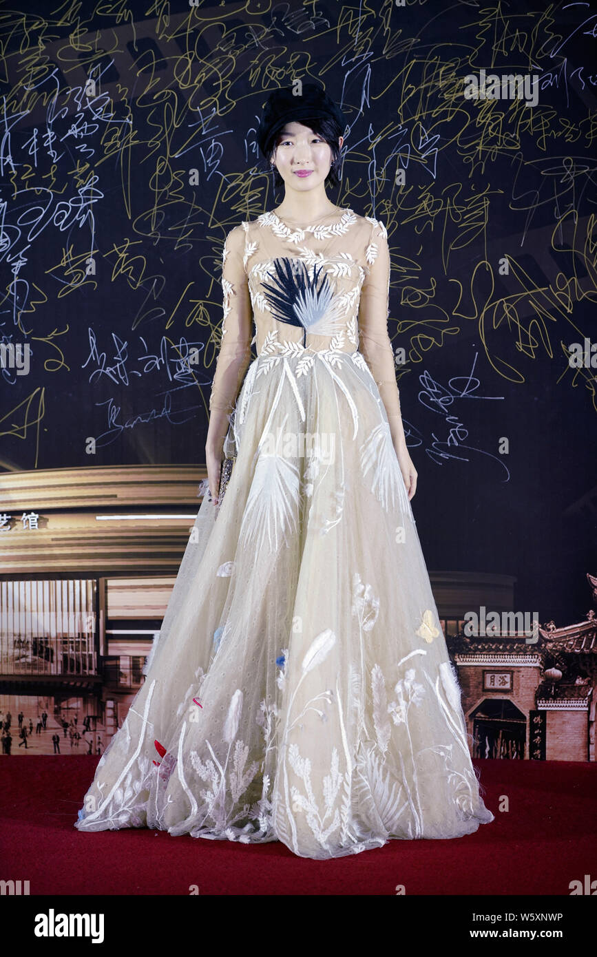 Chinese actress Zhou Dongyu arrives on the red carpet ceremony of the ...