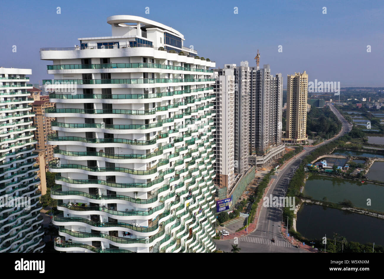 A view of two instant noodle-shaped high-rise residential apartment ...