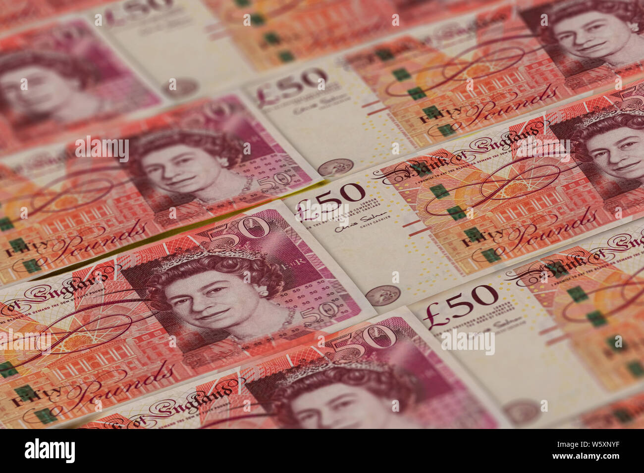 50 Great Britain Pounds banknotes background. GBP pattern. Queen ...