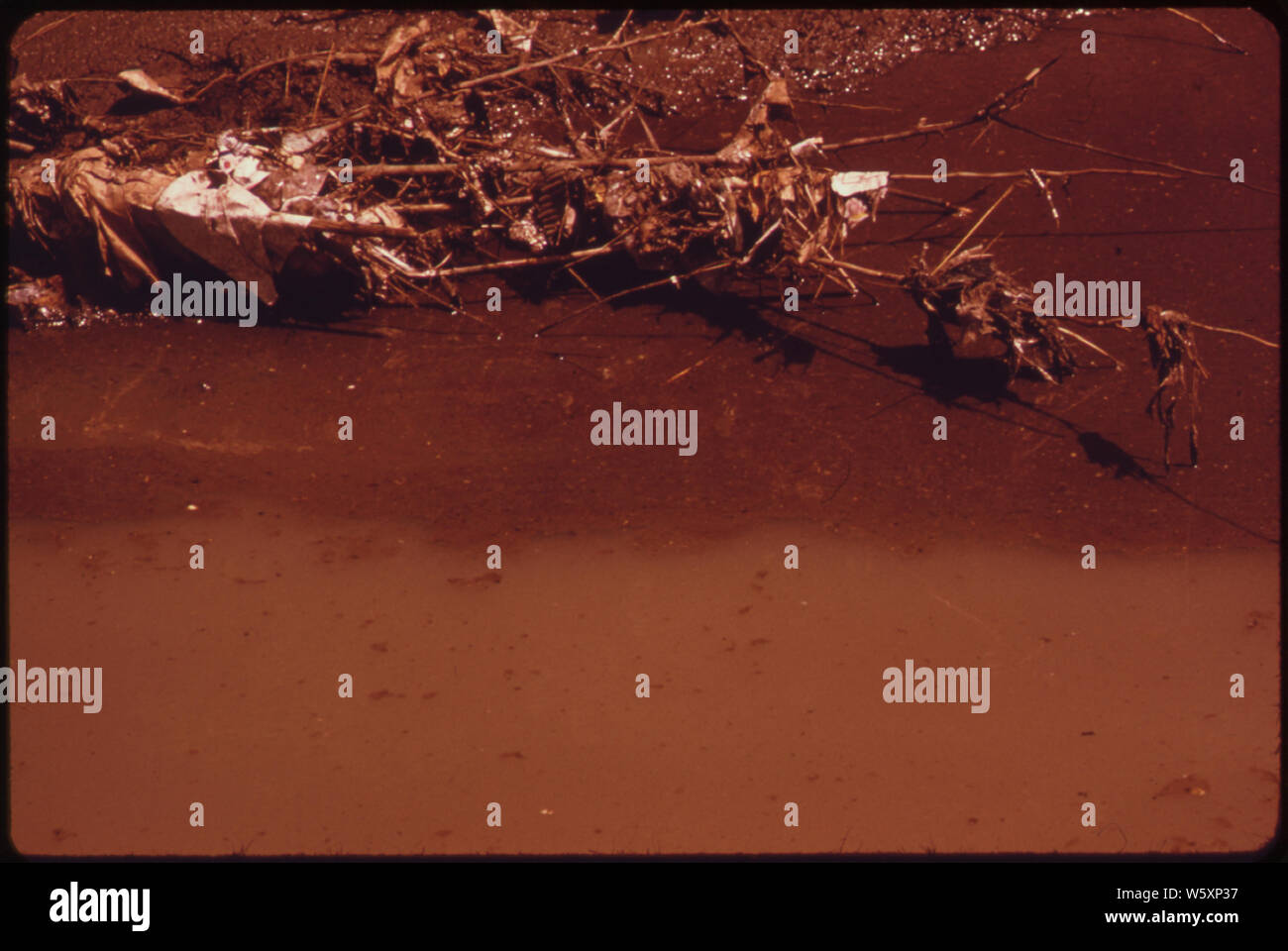 SEWER OUTLET ON THE NORTH SIDE OF THE 12TH STREET BRIDGE SHOWING OIL ...