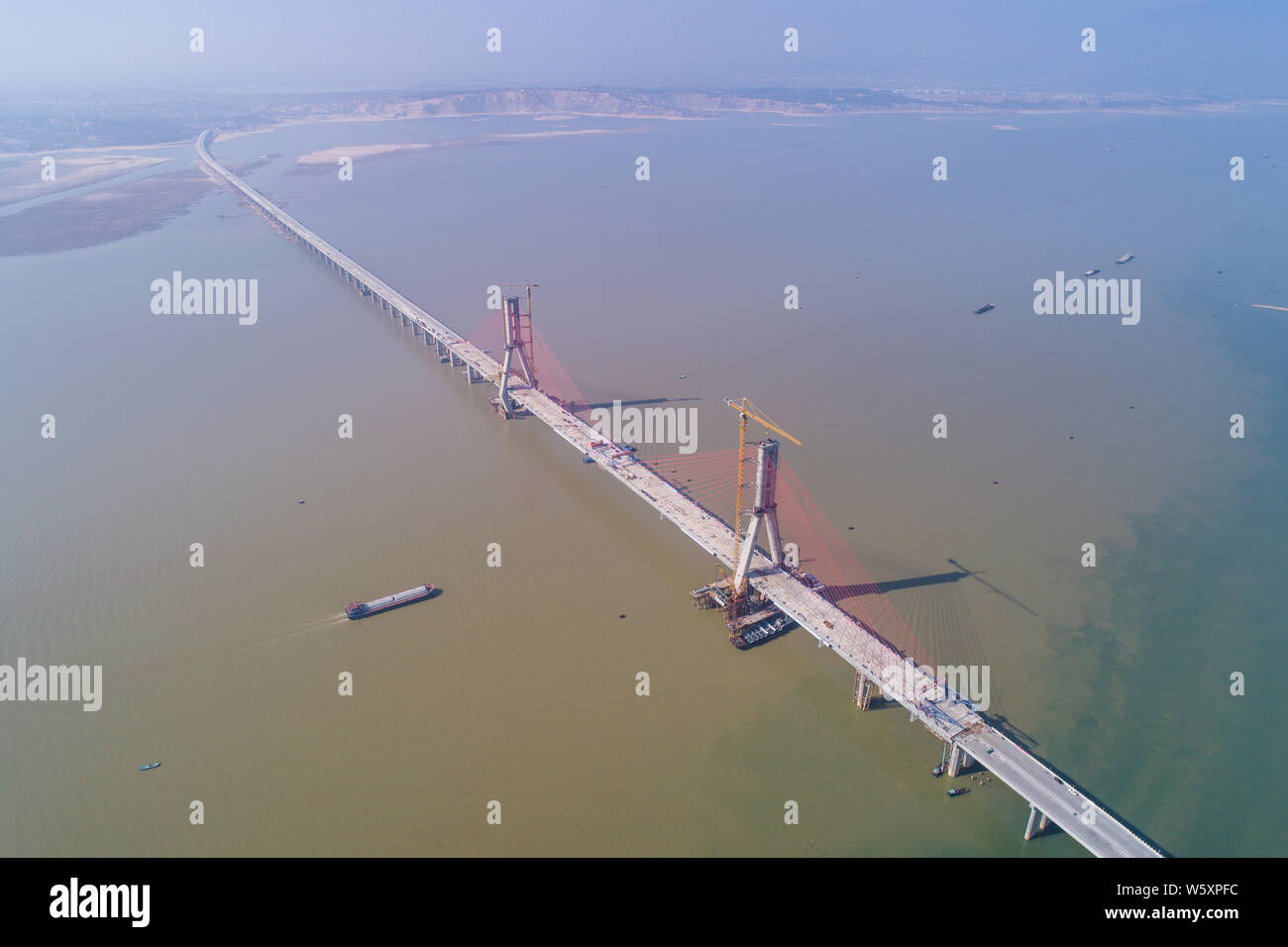 An aerial view of the construction site of the Poyang Lake No. 2 Bridge ...