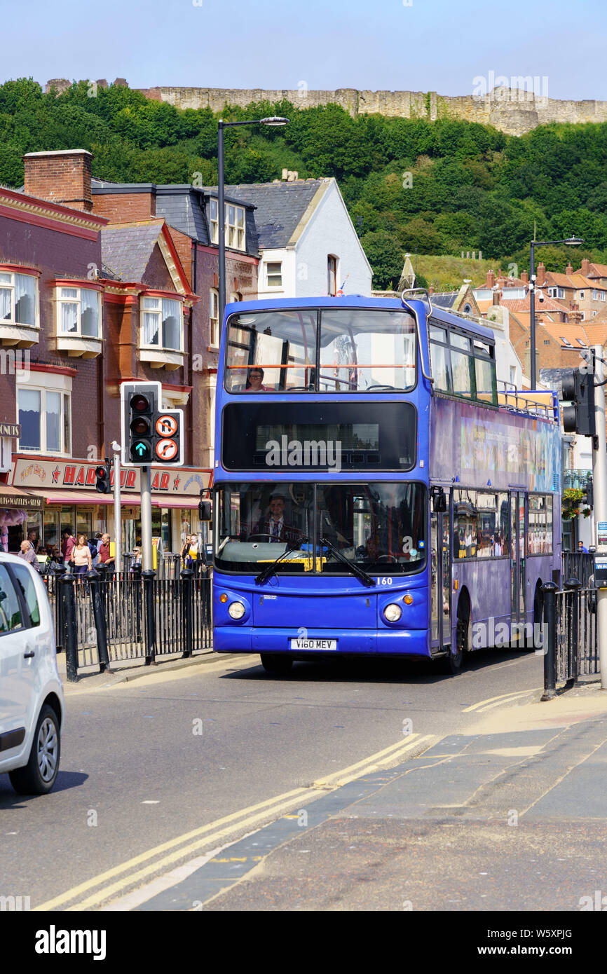 Blue Double-decker open top bus travelling between the North and South ...