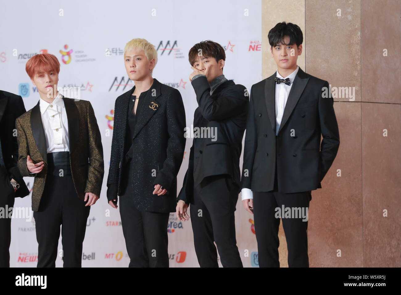 Members of South Korean boy band iKon pose as they arrive on the red ...