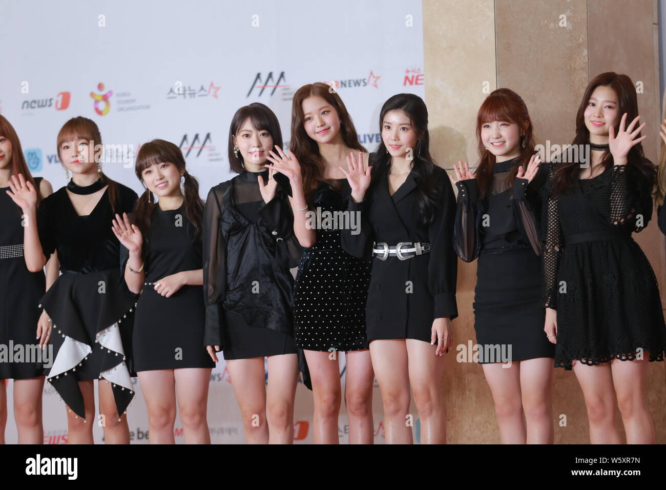 Members of South Korean girl group Izone, stylized as IZ*ONE, pose as ...