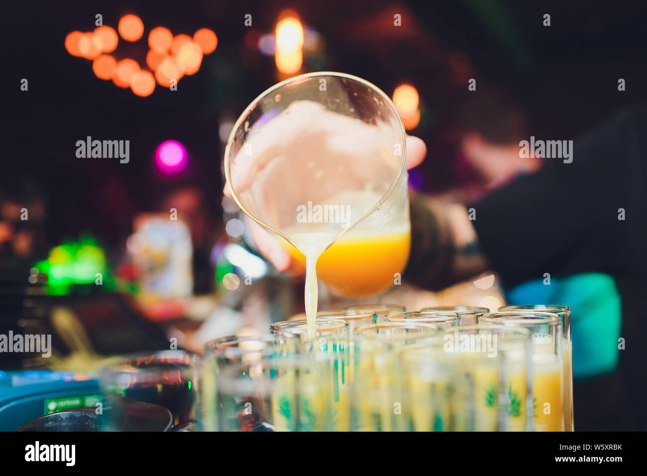 Hand pouring liquor isolated hi-res stock photography and images - Alamy