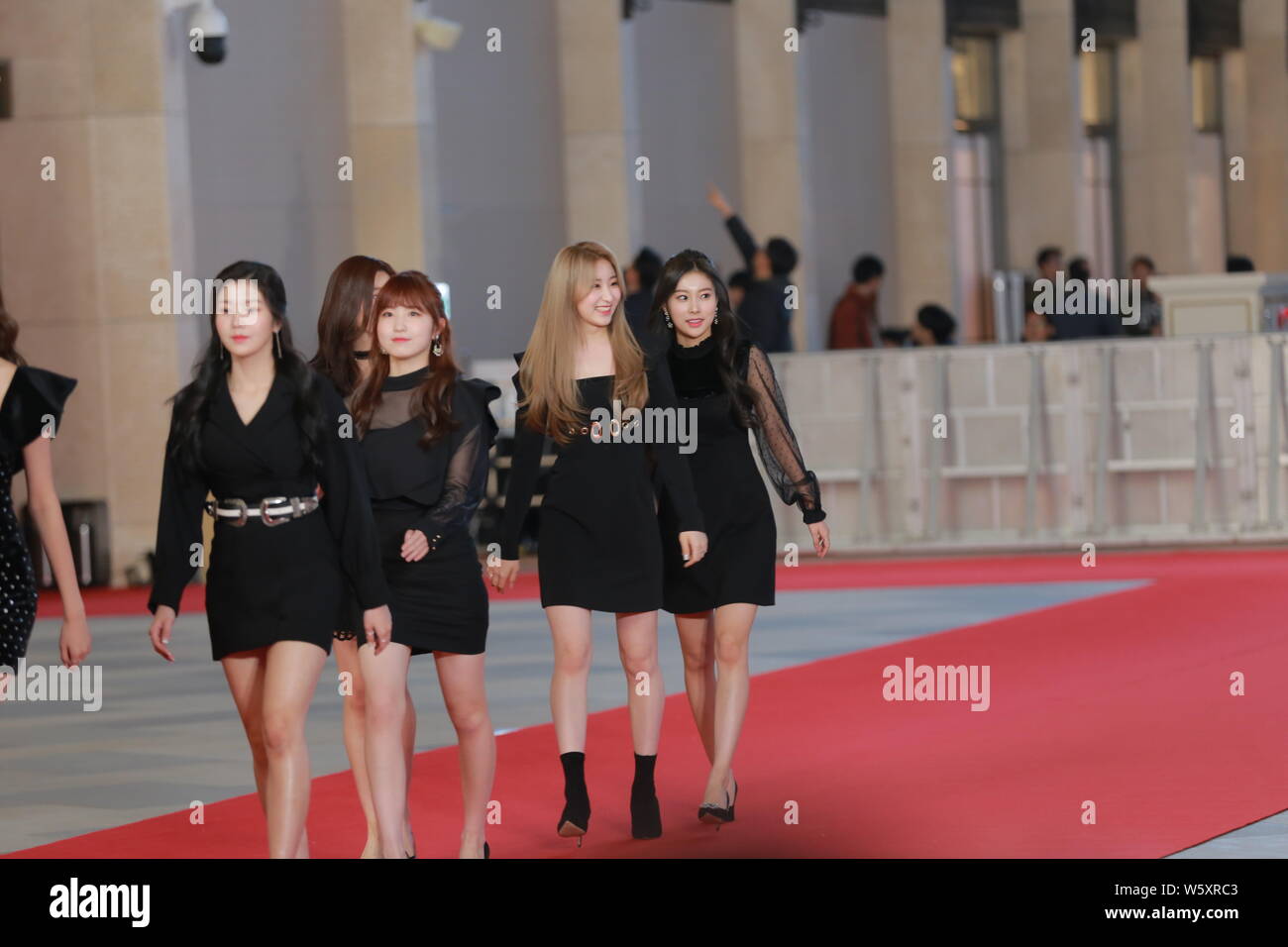 Members of South Korean girl group Izone, stylized as IZ*ONE, pose as ...