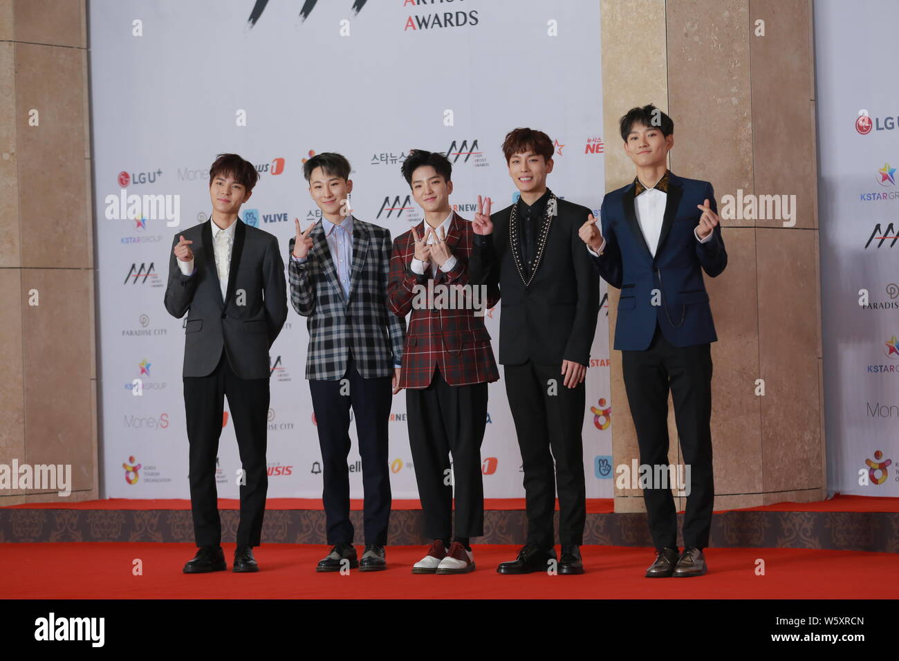 Members of South Korean boy band W24 pose as they arrive on the red carpet for 2018 Asia Artist ...
