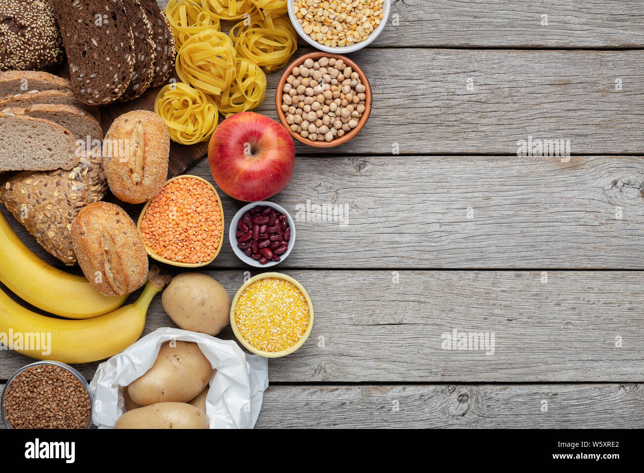 Full of healthy carbohydrate food on wooden background Stock Photo - Alamy