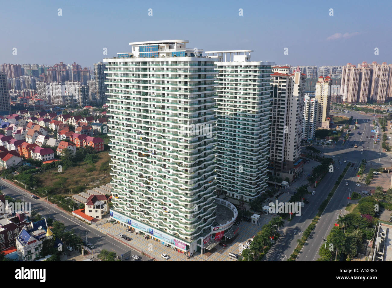 A view of two instant noodle-shaped high-rise residential apartment ...
