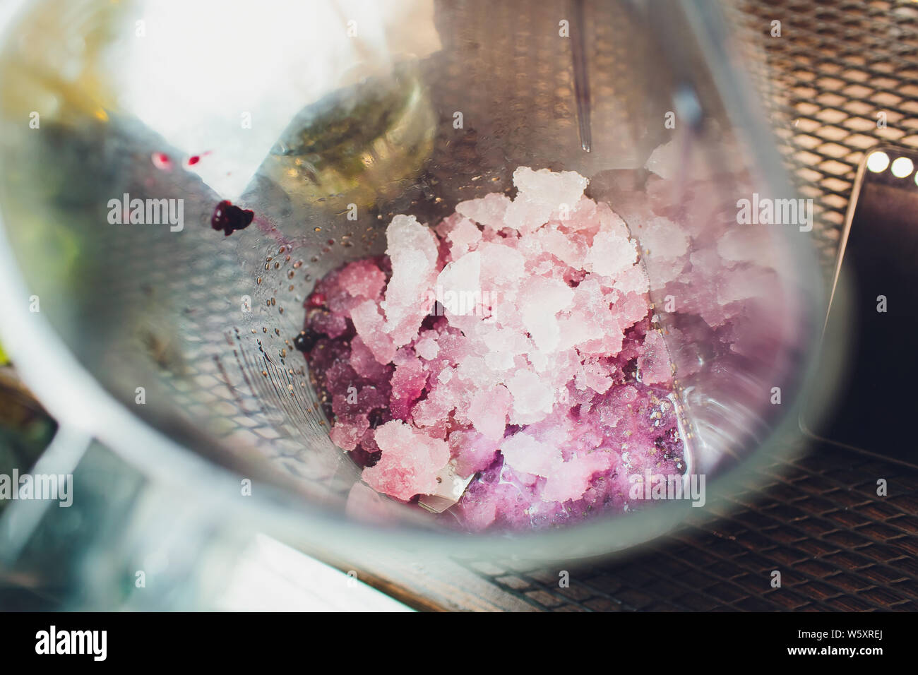 breaking ice splitting ice on a black background Stock Photo - Alamy