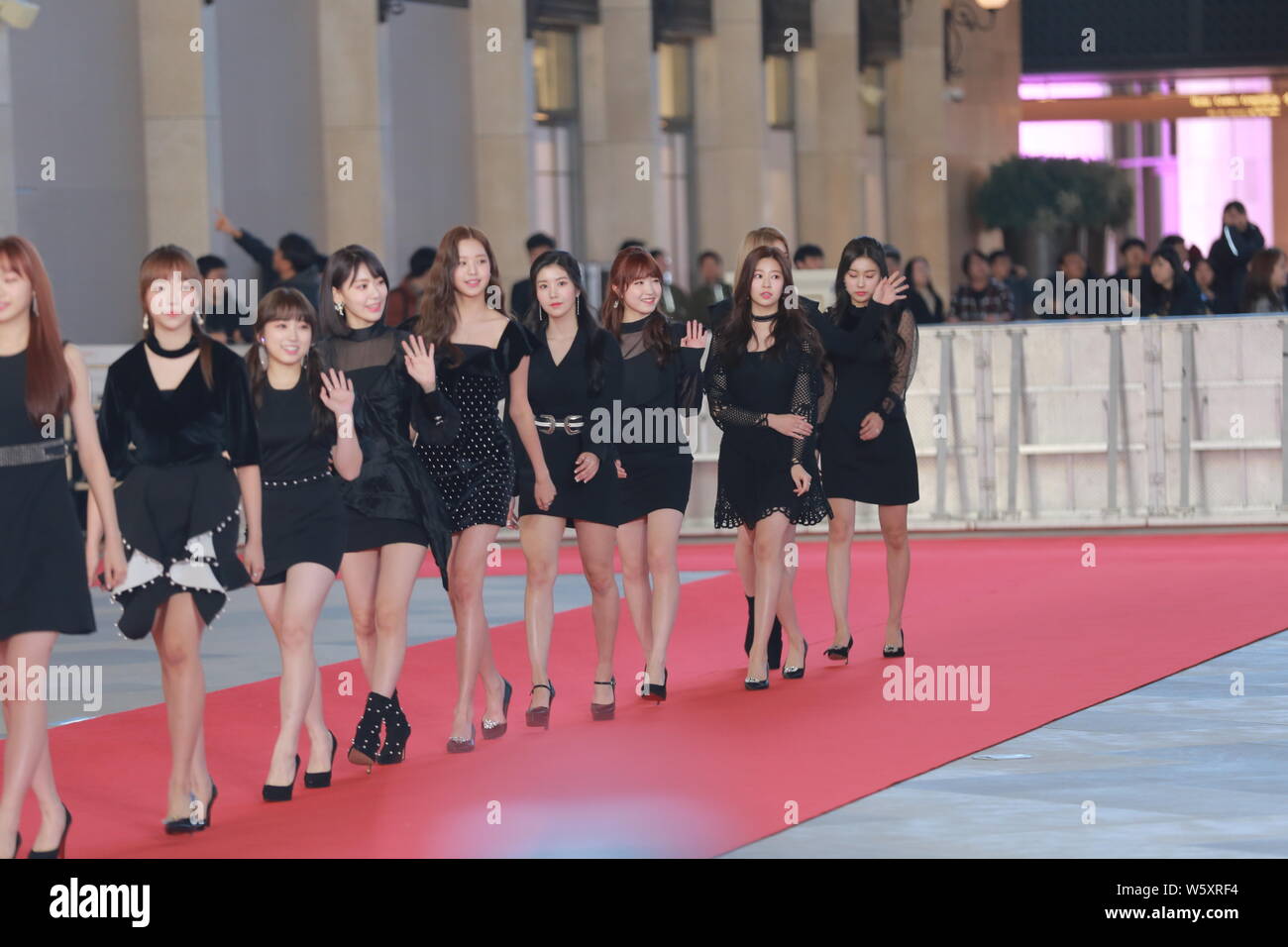 Members of South Korean girl group Izone, stylized as IZ*ONE, pose as ...