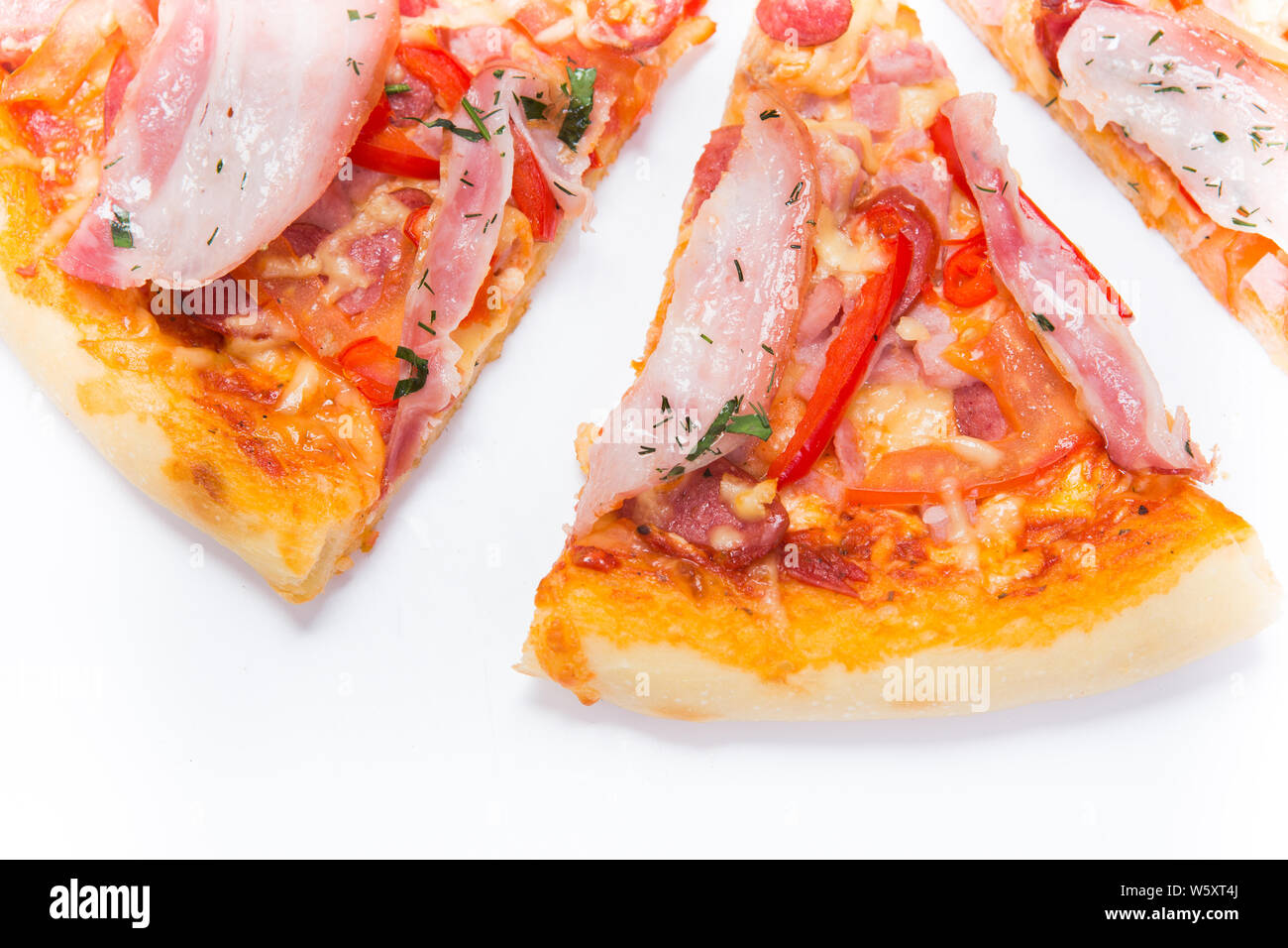 Pizza slice top view isolated on white background, with onions, bacon ...