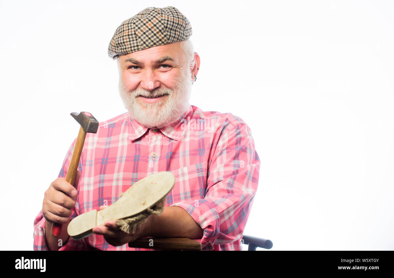 Cobbler workmanship. shoemaker working with leather textile and hammer ...