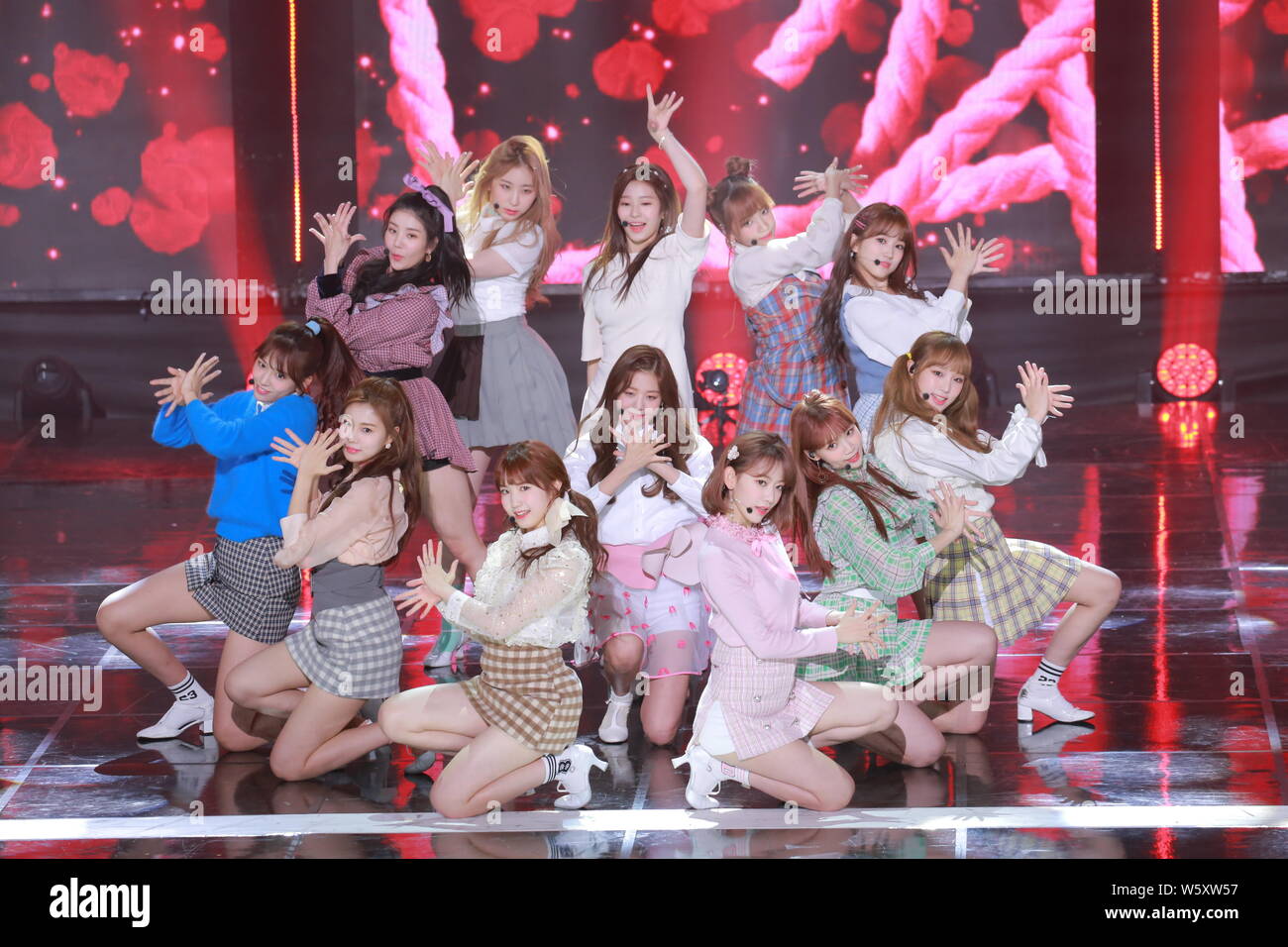 Members of South Korean girl group Izone, stylized as IZ*ONE, perform ...