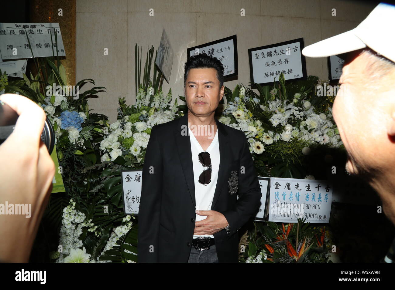 Hong Kong actor Ray Lui Leung-wai attends the funeral ceremony for ...