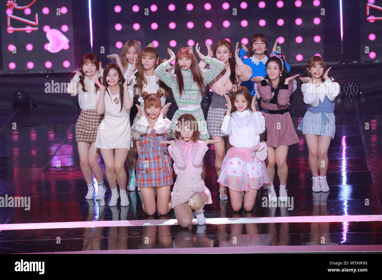 Members of South Korean girl group Izone, stylized as IZ*ONE, perform ...