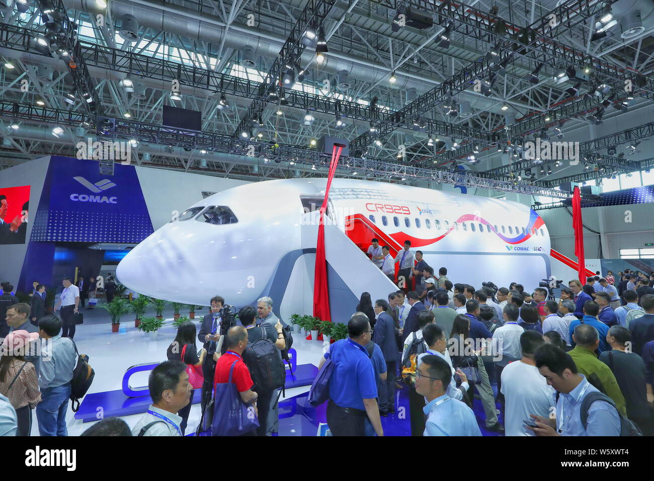 People visit a full-size mock-up of the CR929 widebody jet displayed by ...