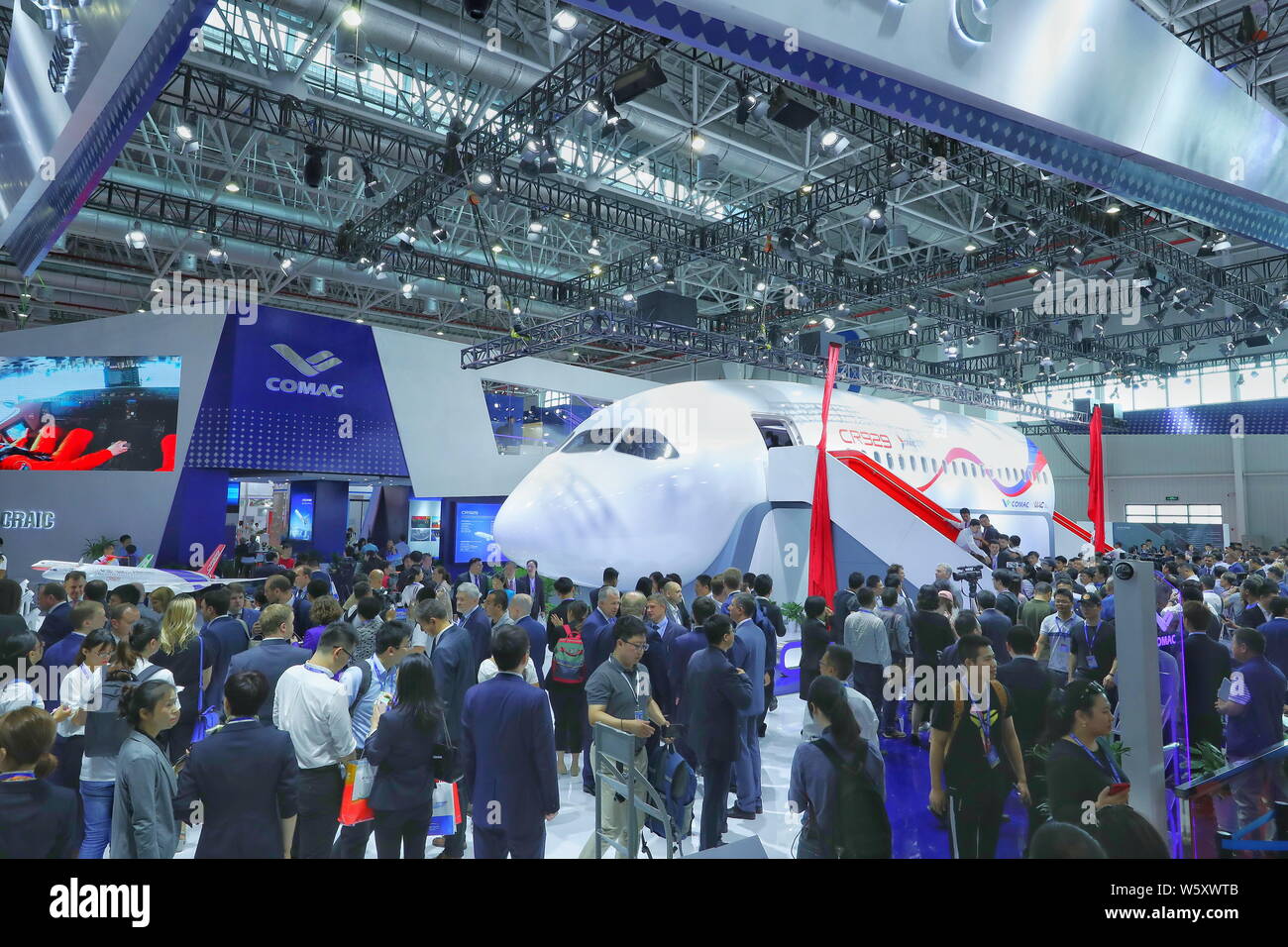 People visit a full-size mock-up of the CR929 widebody jet displayed by ...