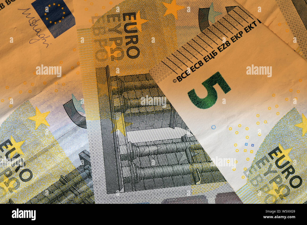 Five euro banknotes close up. Money background brown color toned Stock ...