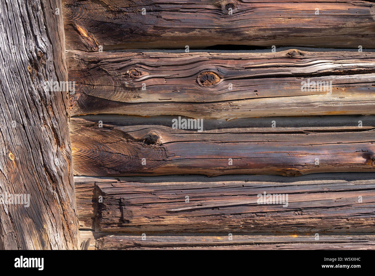 Background texture of old weathered wood cladding on a wall with ...