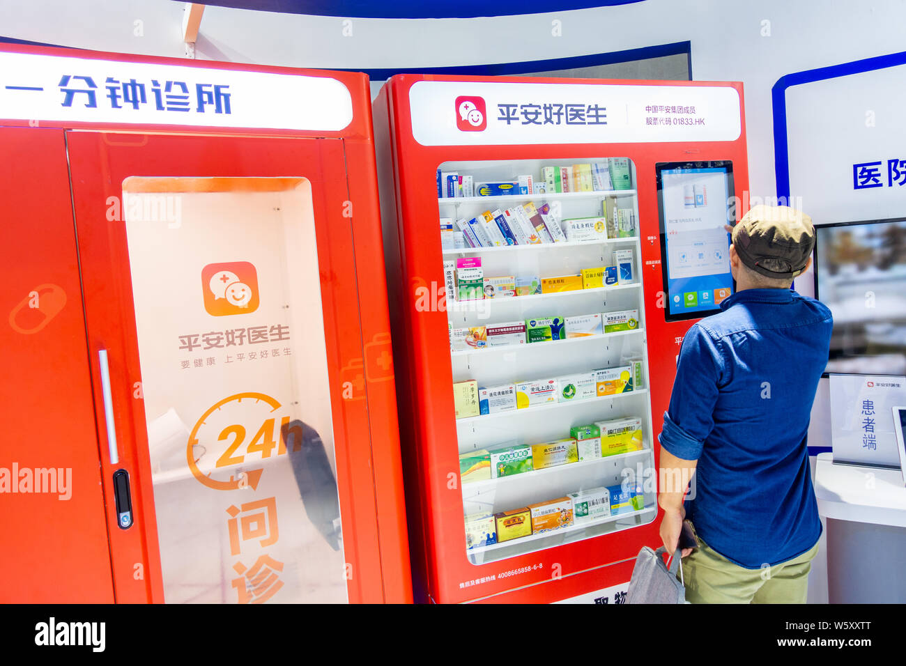 --FILE--A local resident buys medicines through a 24-hour vending ...