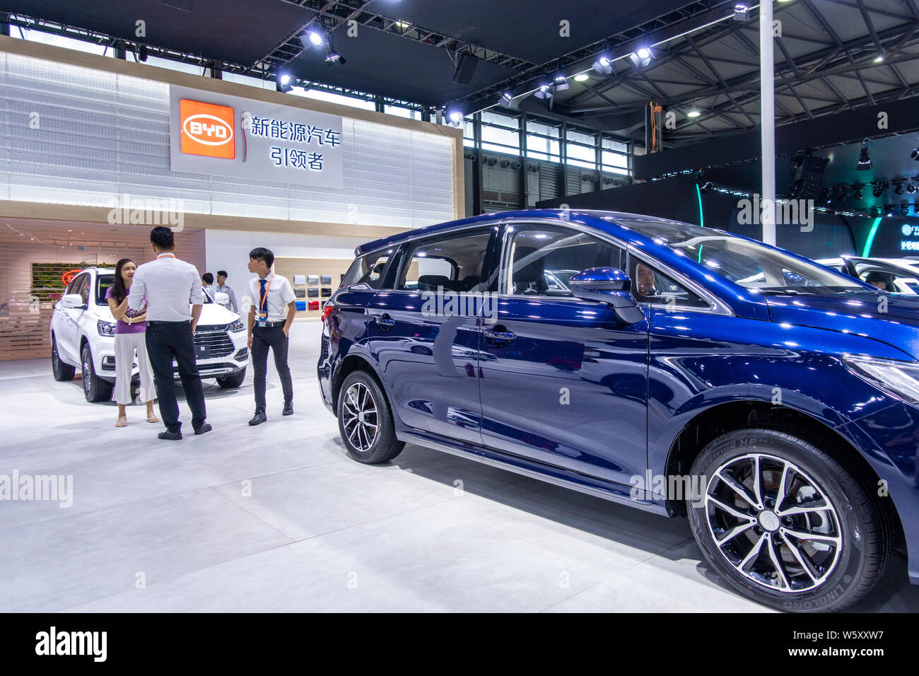 --FILE--People visit the stand of Chinese top electric carmaker BYD ...