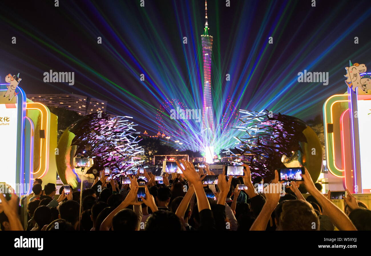 Tourists and visitors view colored lights during the seventh Guangzhou International Light ...