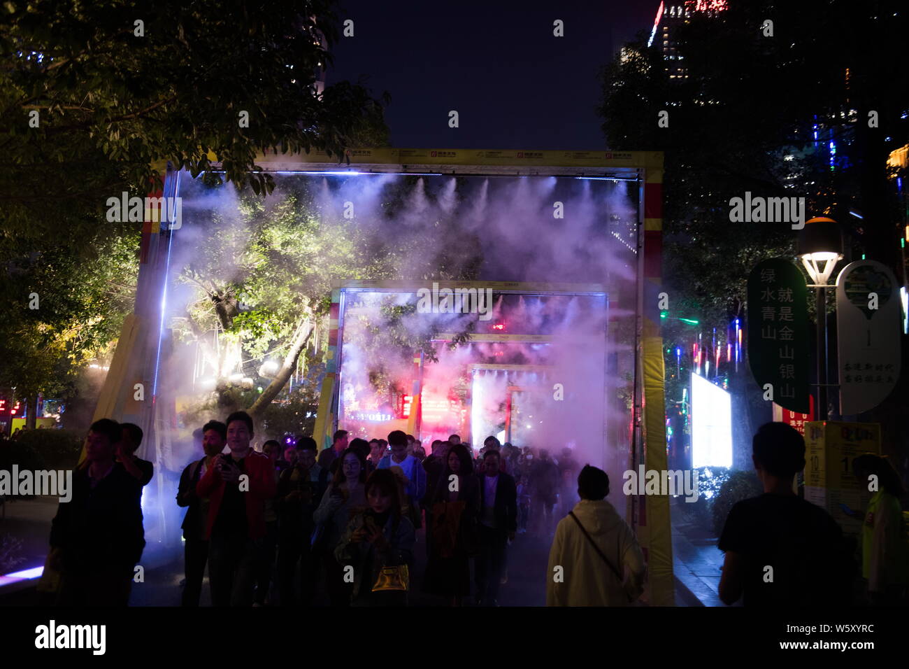 Tourists and visitors view colored lights during the seventh Guangzhou ...