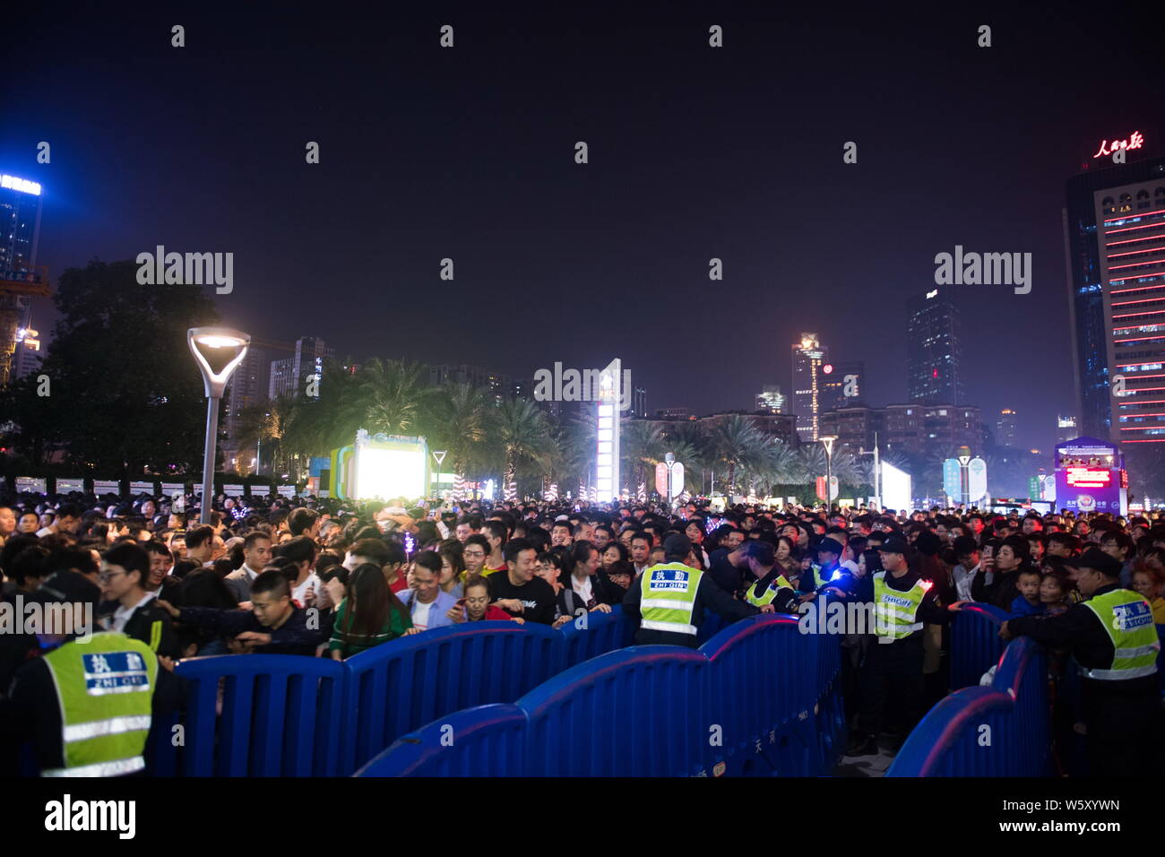 Tourists and visitors view colored lights during the seventh Guangzhou International Light ...