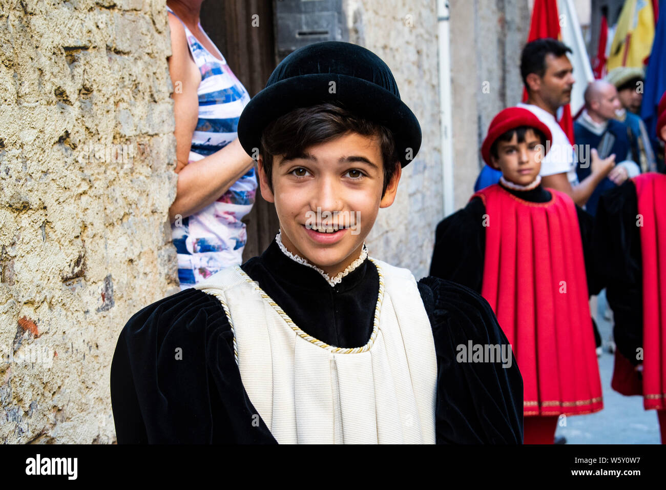 Young boy in medieval costume for the Palio in Siena, Italy Stock Photo ...