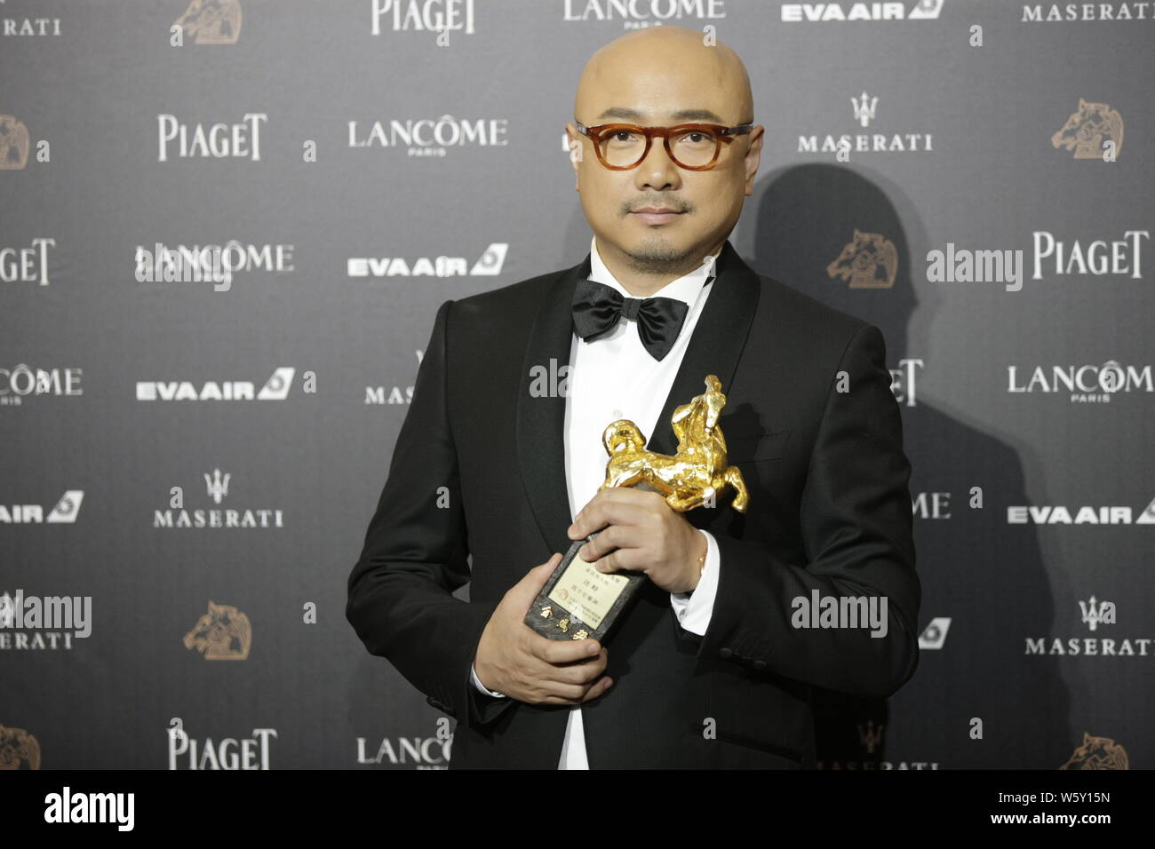 Chinese actor Xu Zheng poses with his trophy of the Best Leading Actor ...