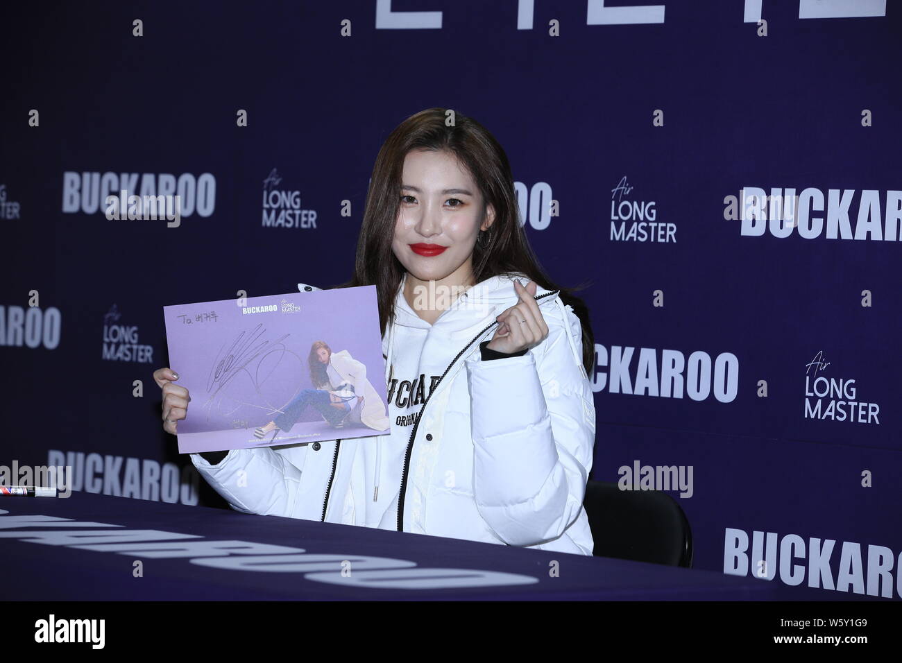 South Korean singer Lee Sun-mi, also known as Sunmi, attends a signing ...