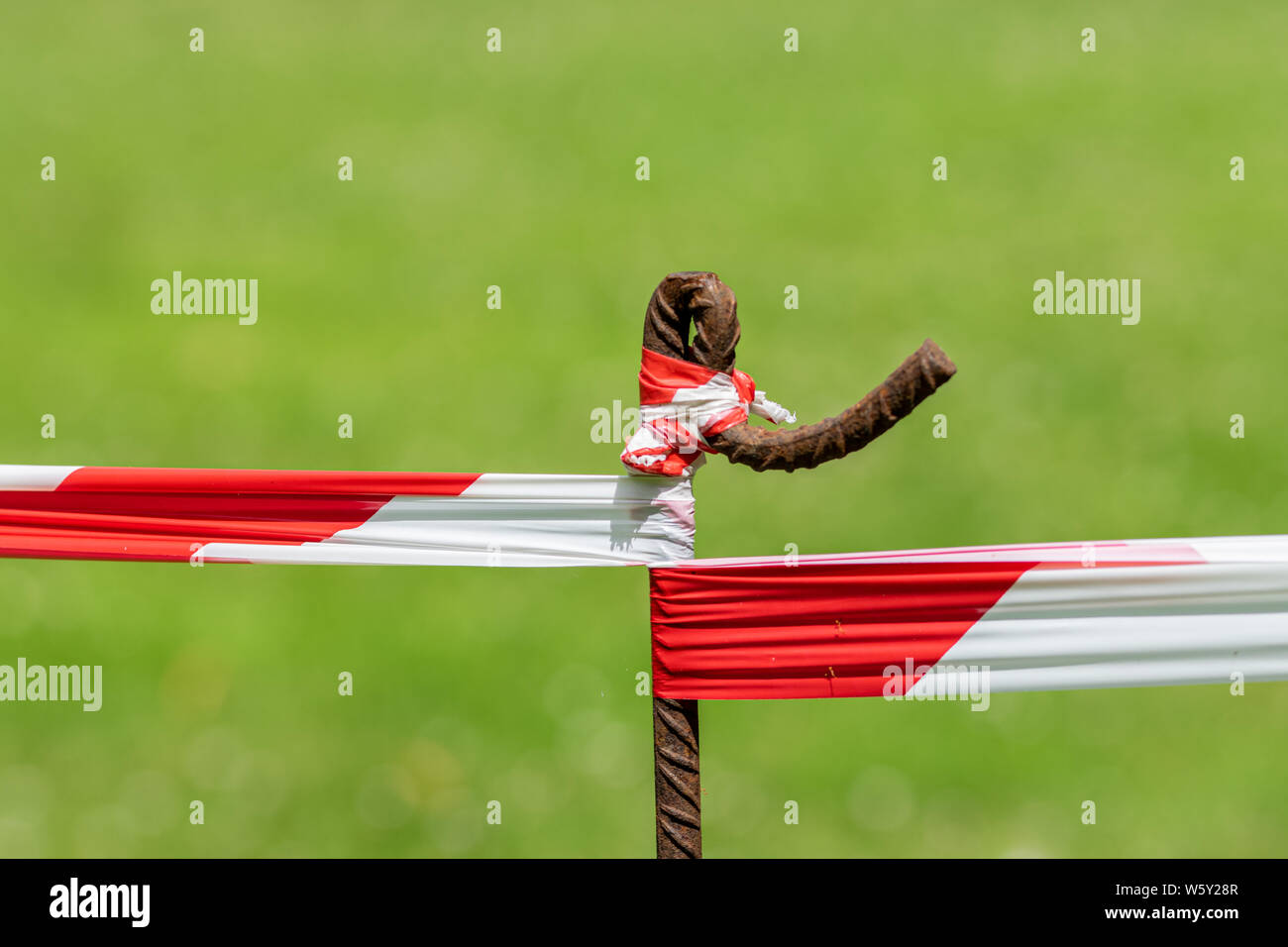 Red and white temporary perimeter tape Stock Photo - Alamy