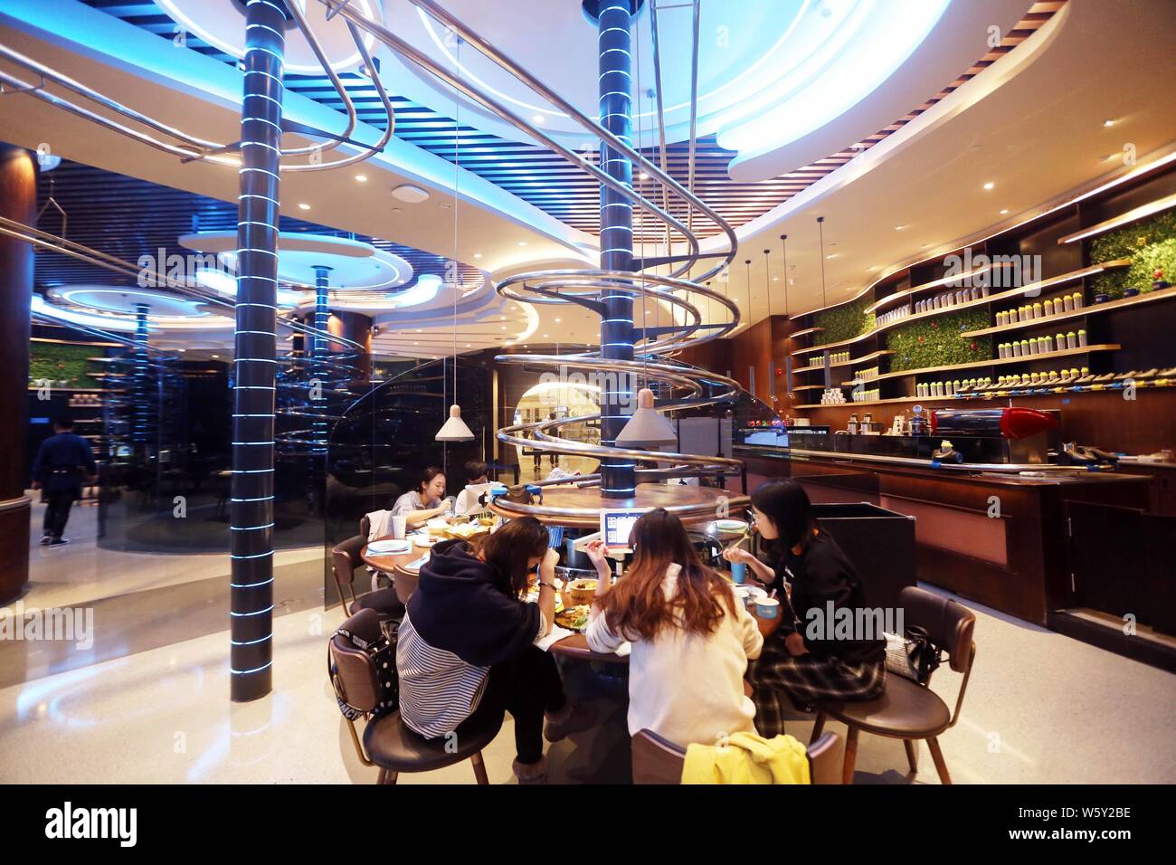 Customers dine in the world's tenth and Asia's third spaceship-themed ...