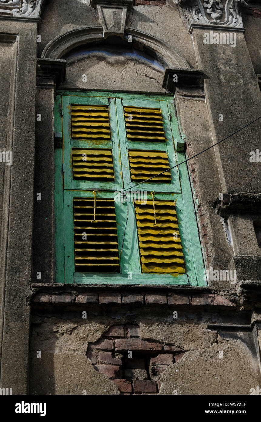 Traditional window on old damaged concrete wall Stock Photo - Alamy
