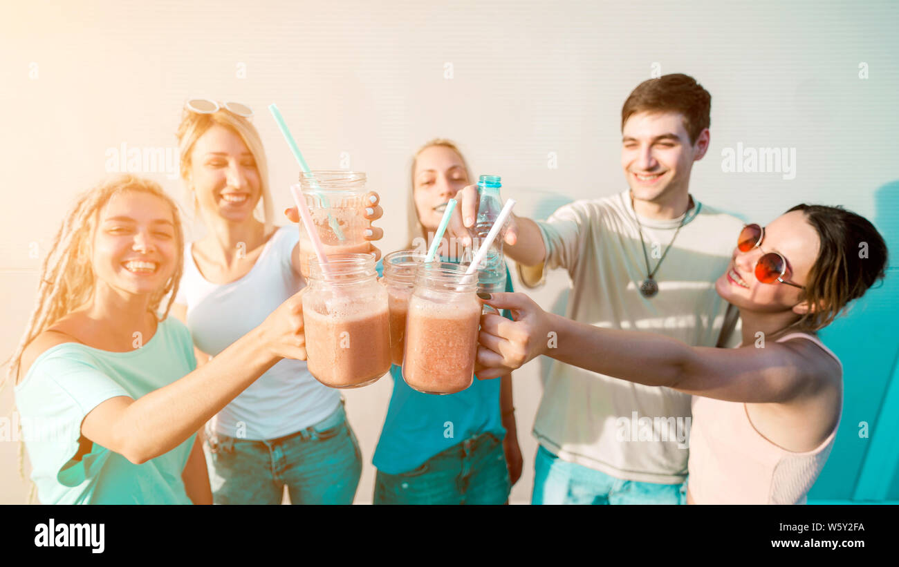 Group of happy young friends having fun and drinking smoothies Stock ...