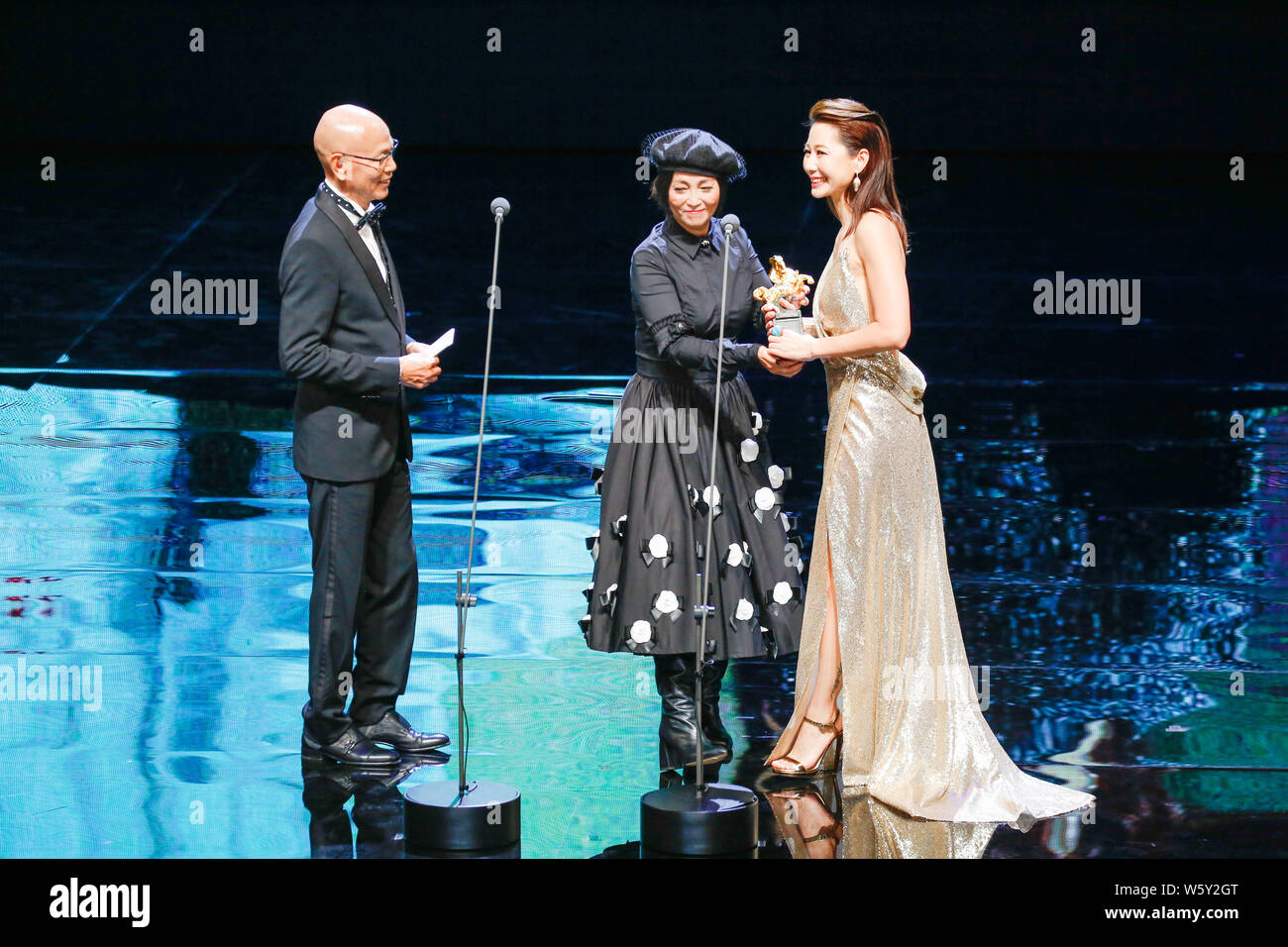 **TAIWAN OUT**Taiwanese actress Ding Ning, right, holds her trophy ...