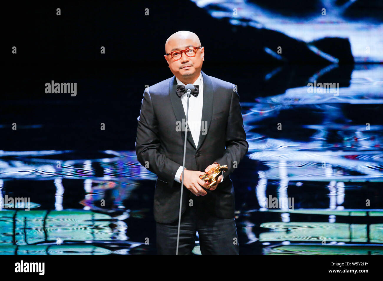 **TAIWAN OUT**Chinese actor Xu Zheng speaks after being awarded with ...