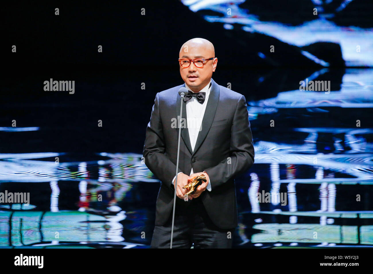 **TAIWAN OUT**Chinese actor Xu Zheng speaks after being awarded with ...