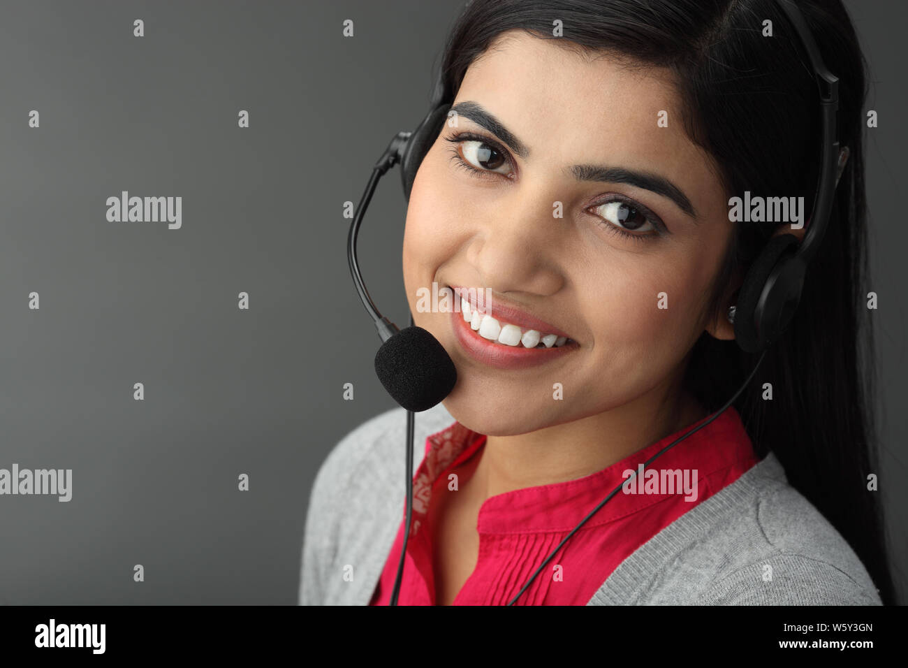 Beautiful young businesswoman wearing headset hi-res stock photography and images - Alamy