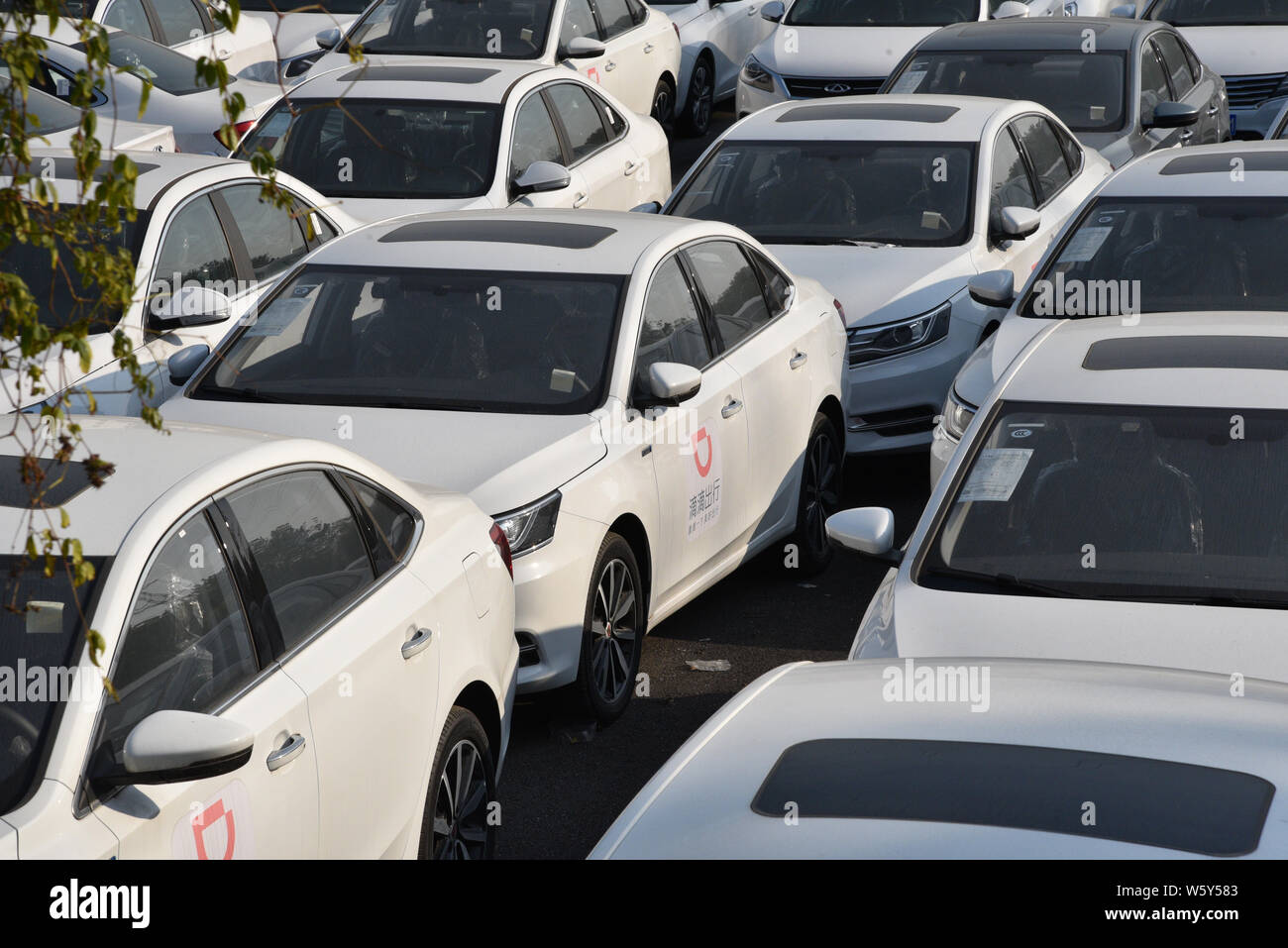 In this aerial view, abandoned ride-hailing vehicles are on displayed ...