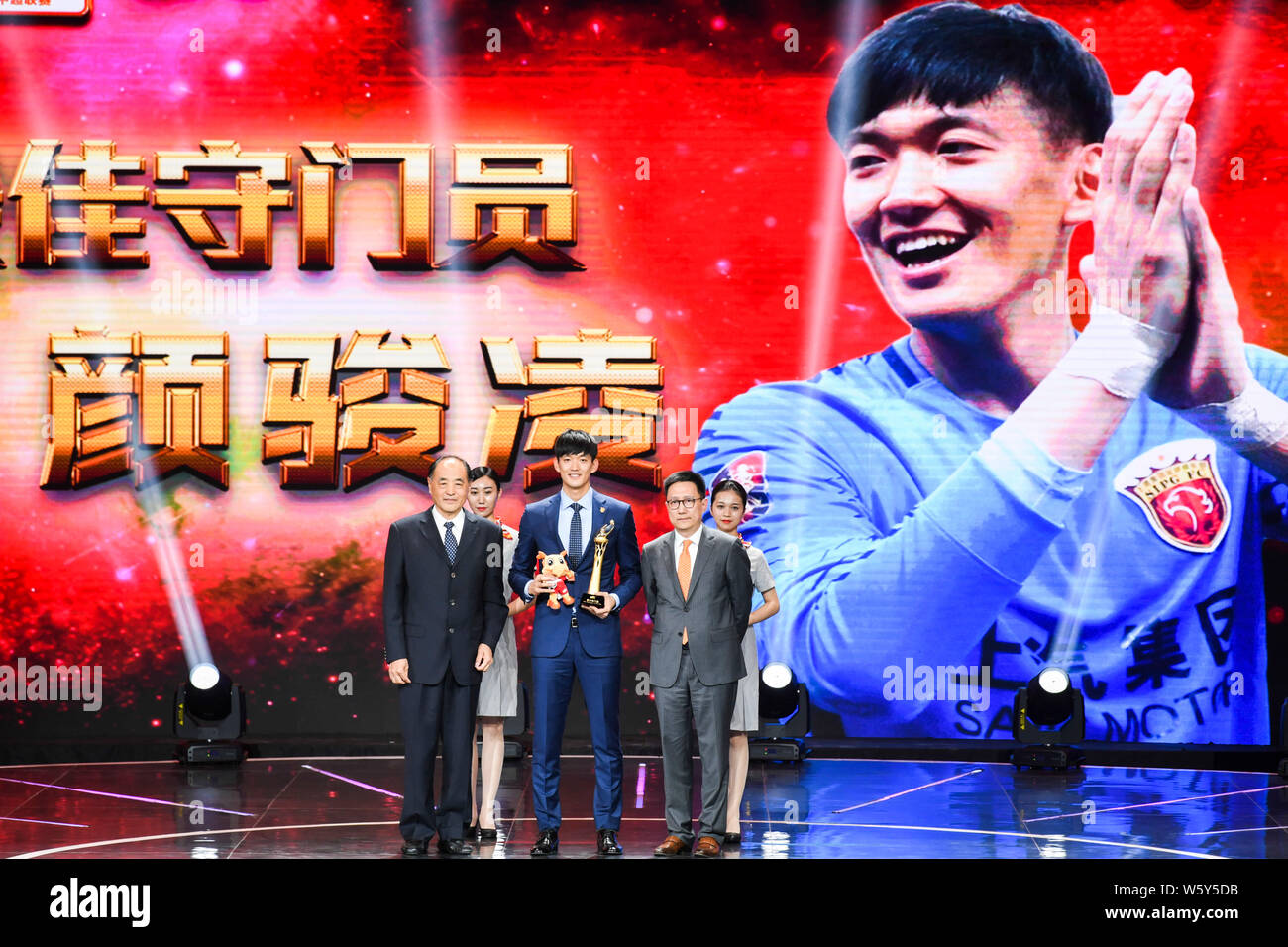 Chinese football player Yan Junling, center, of Shanghai SIPG poses ...