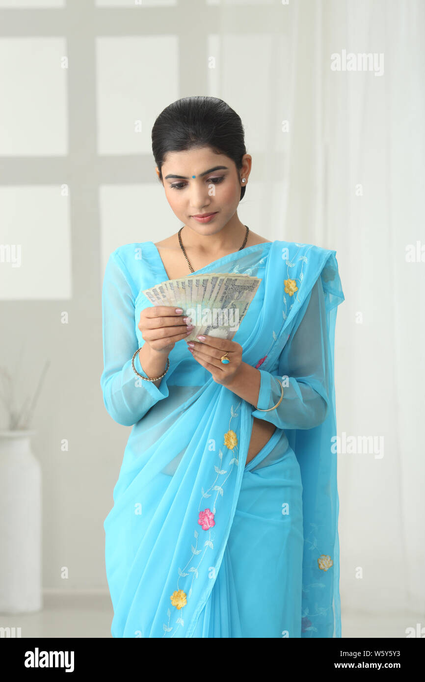 Indian Woman Counting Money High Resolution Stock Photography and ...