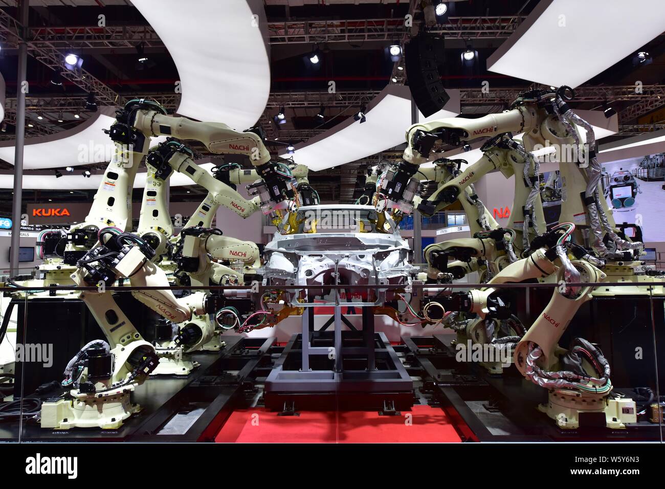 Robot arms of NACHI, equipped with OTC welding technology, perform arc ...
