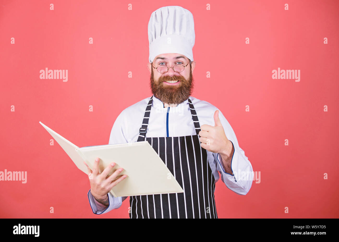 Improve cooking skill. Book recipes. According to recipe. Man bearded ...