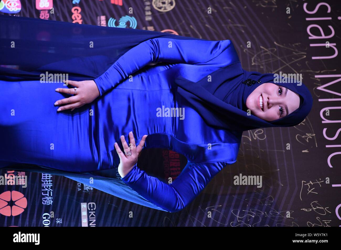 Malaysian singer-songwriter Shila Amzah poses as she arrives on the red ...