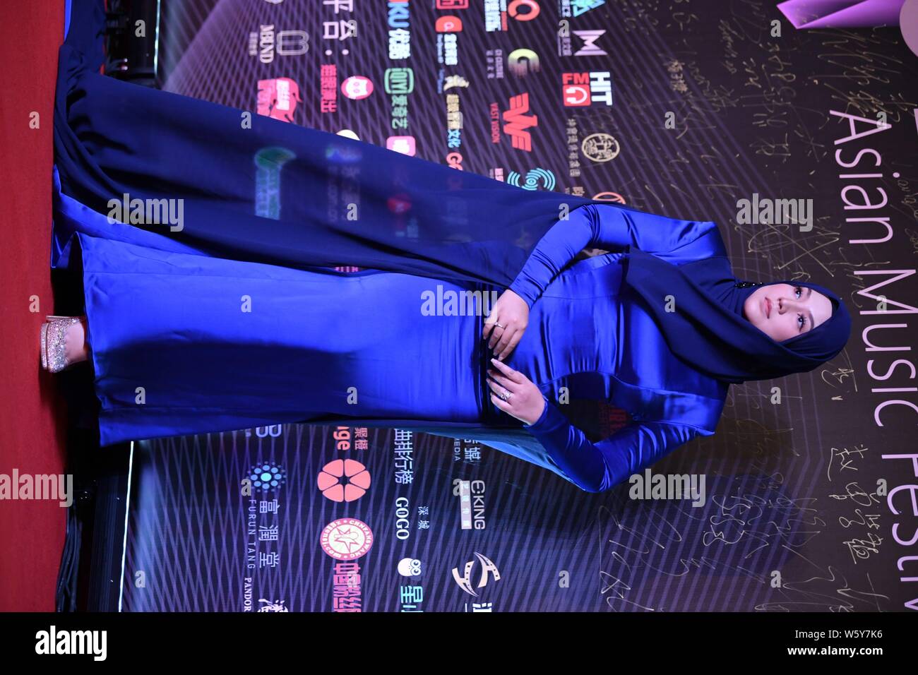 Malaysian singer-songwriter Shila Amzah poses as she arrives on the red ...