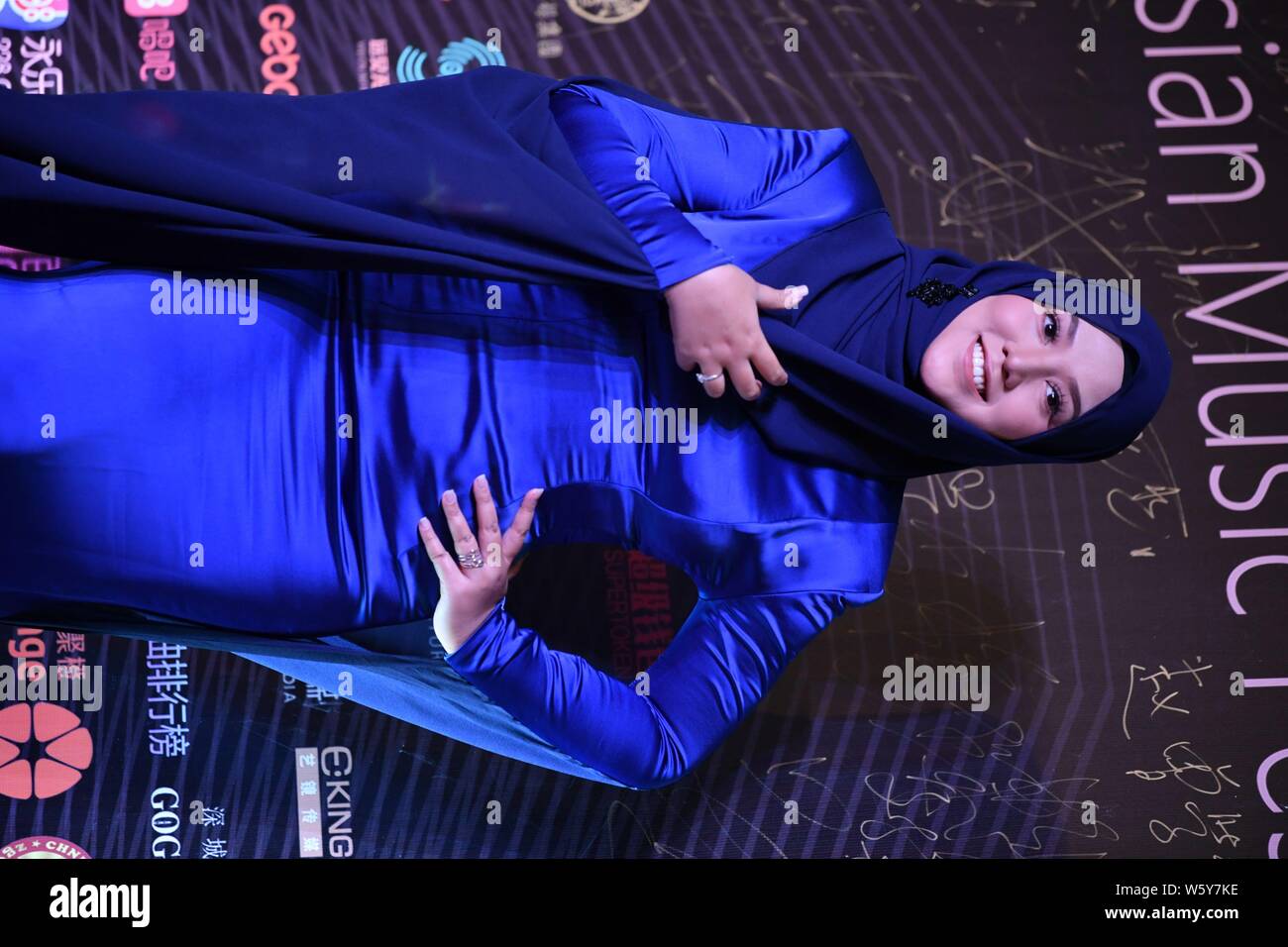 Malaysian singer-songwriter Shila Amzah poses as she arrives on the red ...