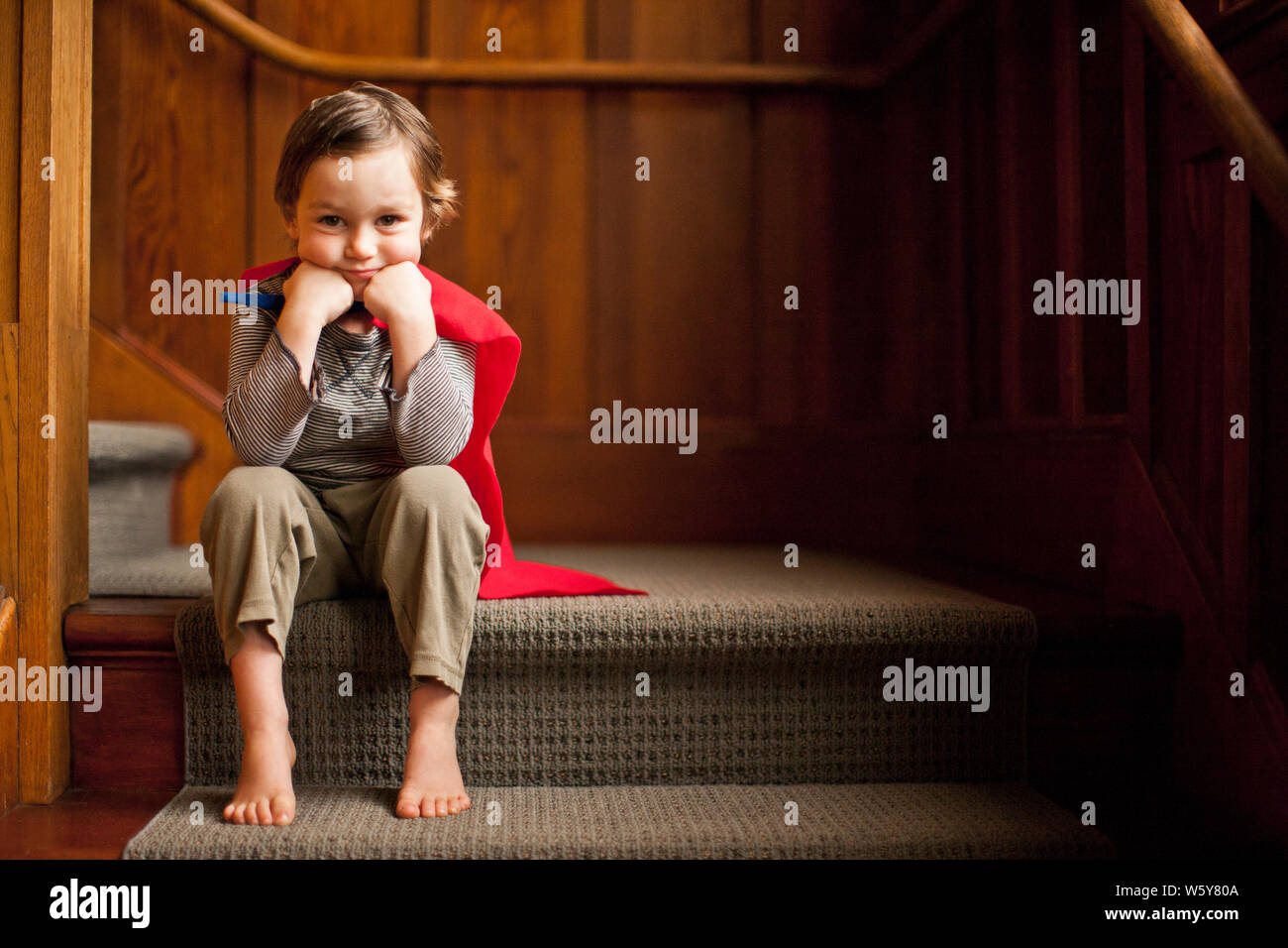 Young boy wearing a superhero cape Stock Photo - Alamy