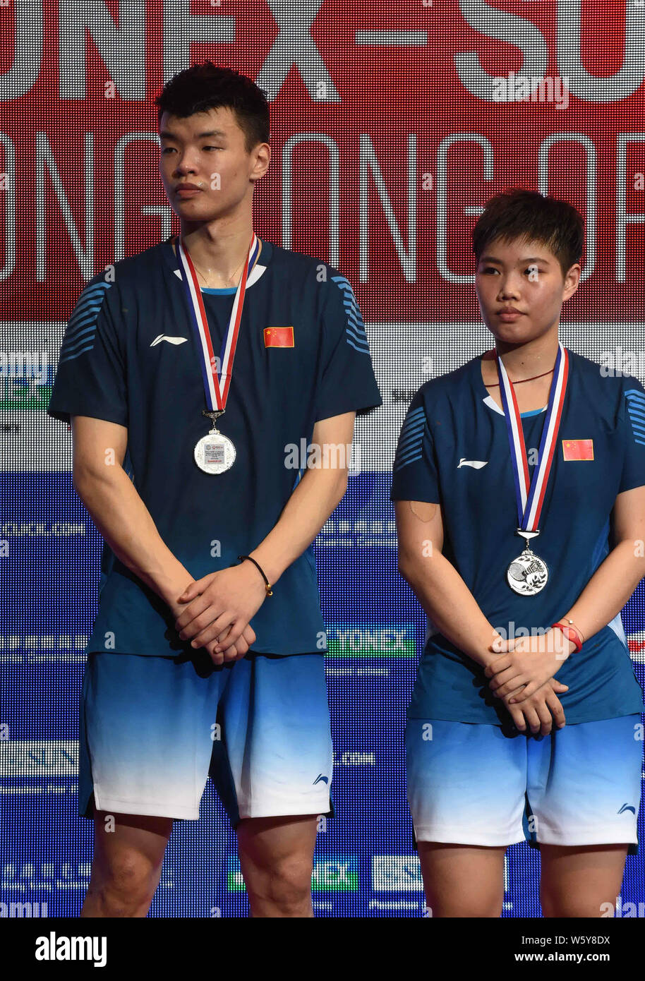 Wang Yilyu, left, and Huang Dongping of China pose on the podium after ...